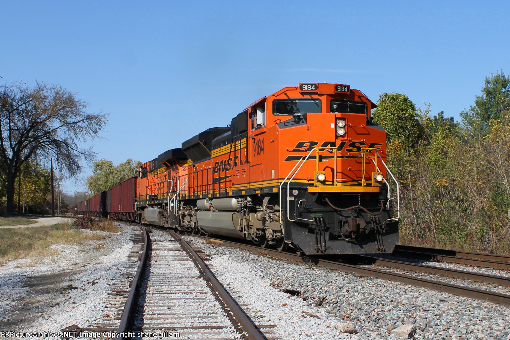 BNSF 9184 leads a loaded ore train out of town.